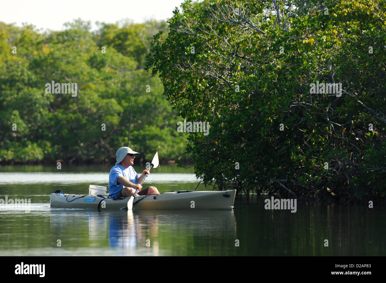 Man paddling and fishing from a kayak, Naples Florida Stock Photo - Alamy