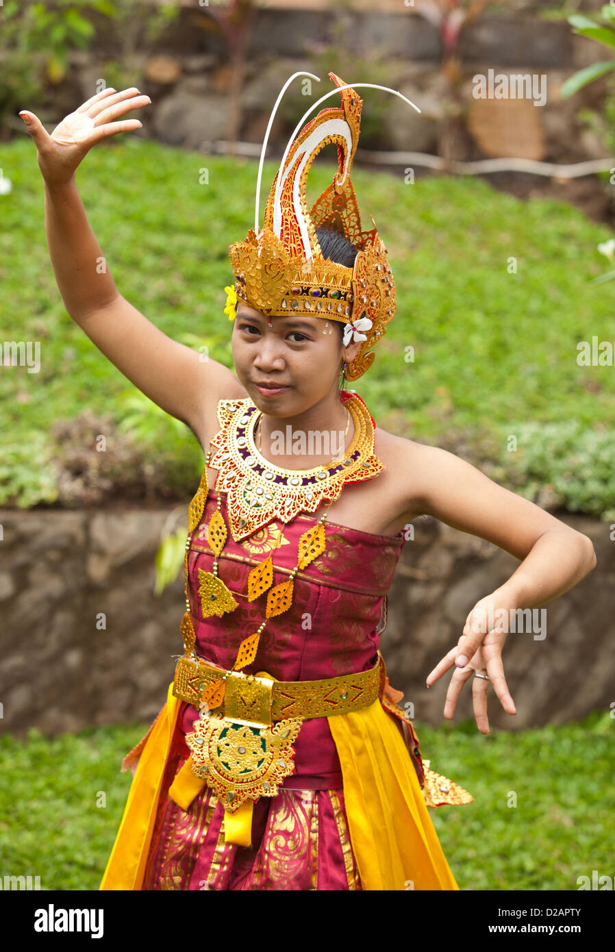 Young Balinese female dancer performing traditional Legong dance Stock ...