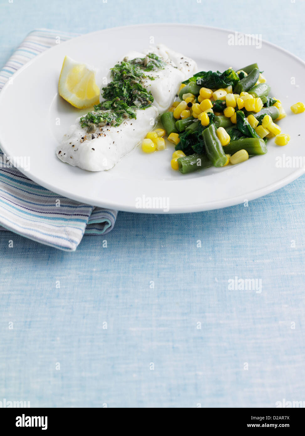Plate of fish with beans and corn Stock Photo - Alamy