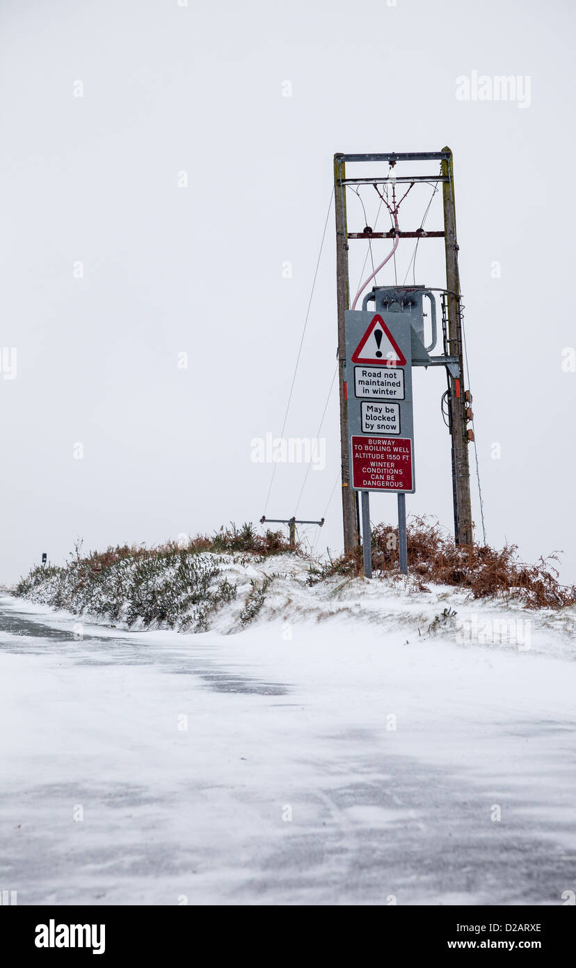 Warning signs on a snowy Burway Road, on the Long Mynd, near Church ...
