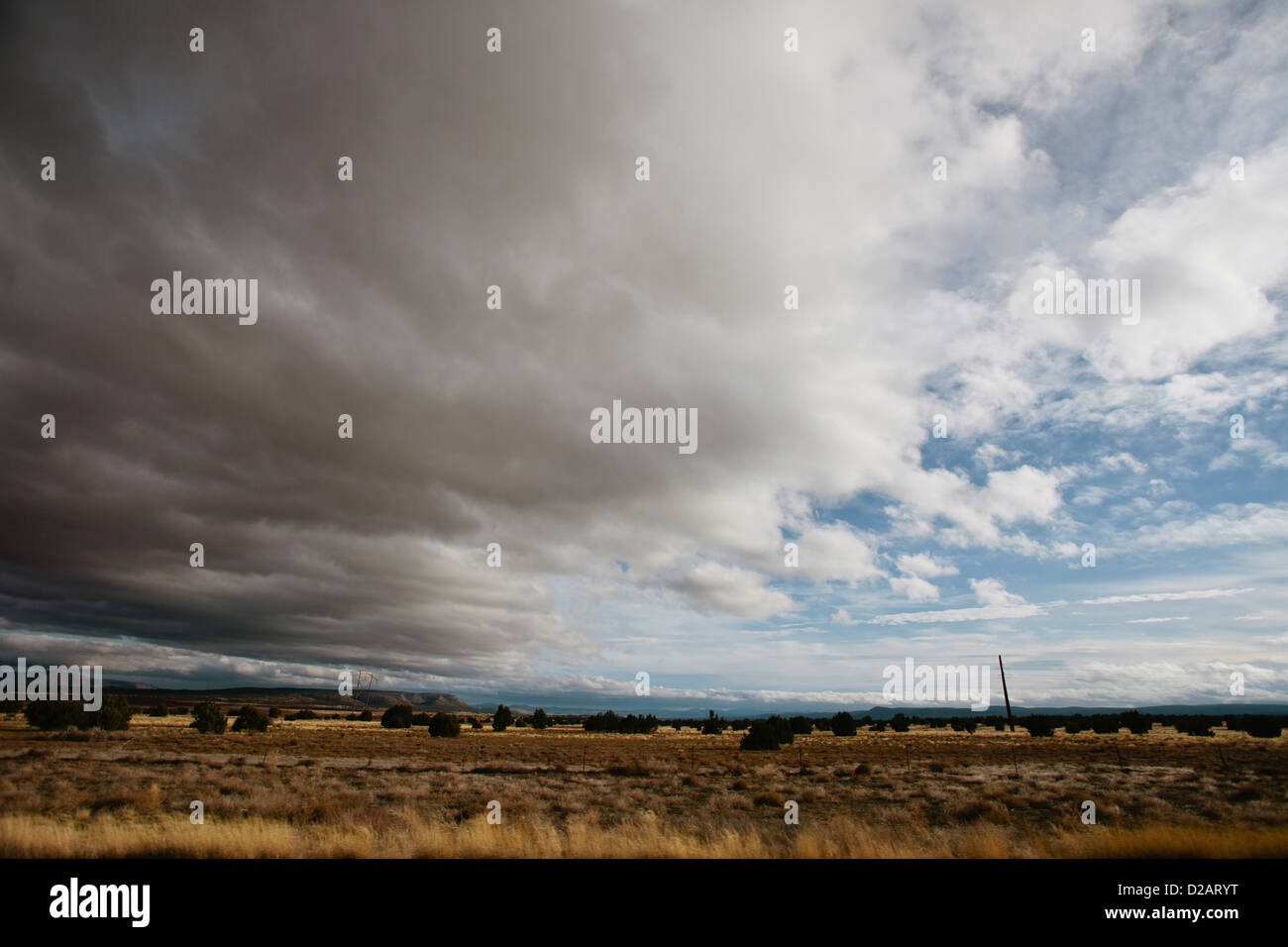 Clouds gathering over dry landscape Stock Photo - Alamy