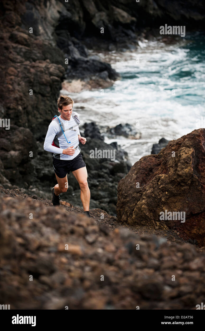 Man running from wave hi-res stock photography and images - Alamy
