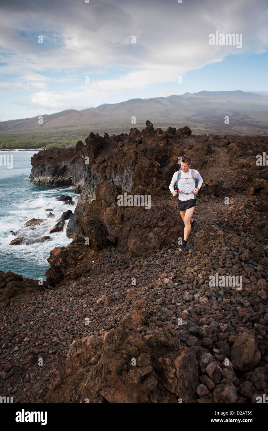 Man running on rocky rural trail Stock Photo - Alamy