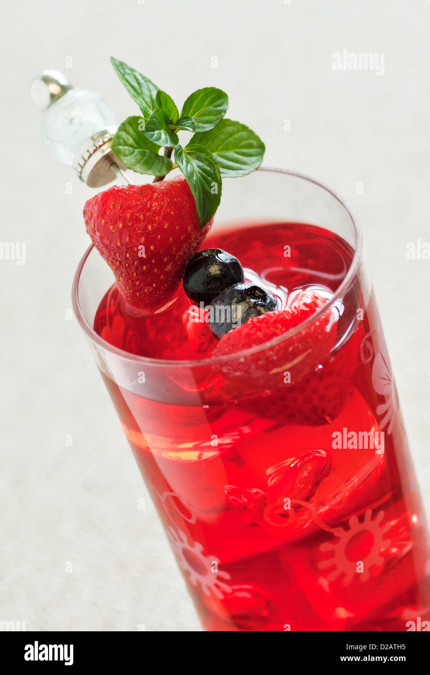 Bright red cranberry iced tea with fruit Stock Photo - Alamy