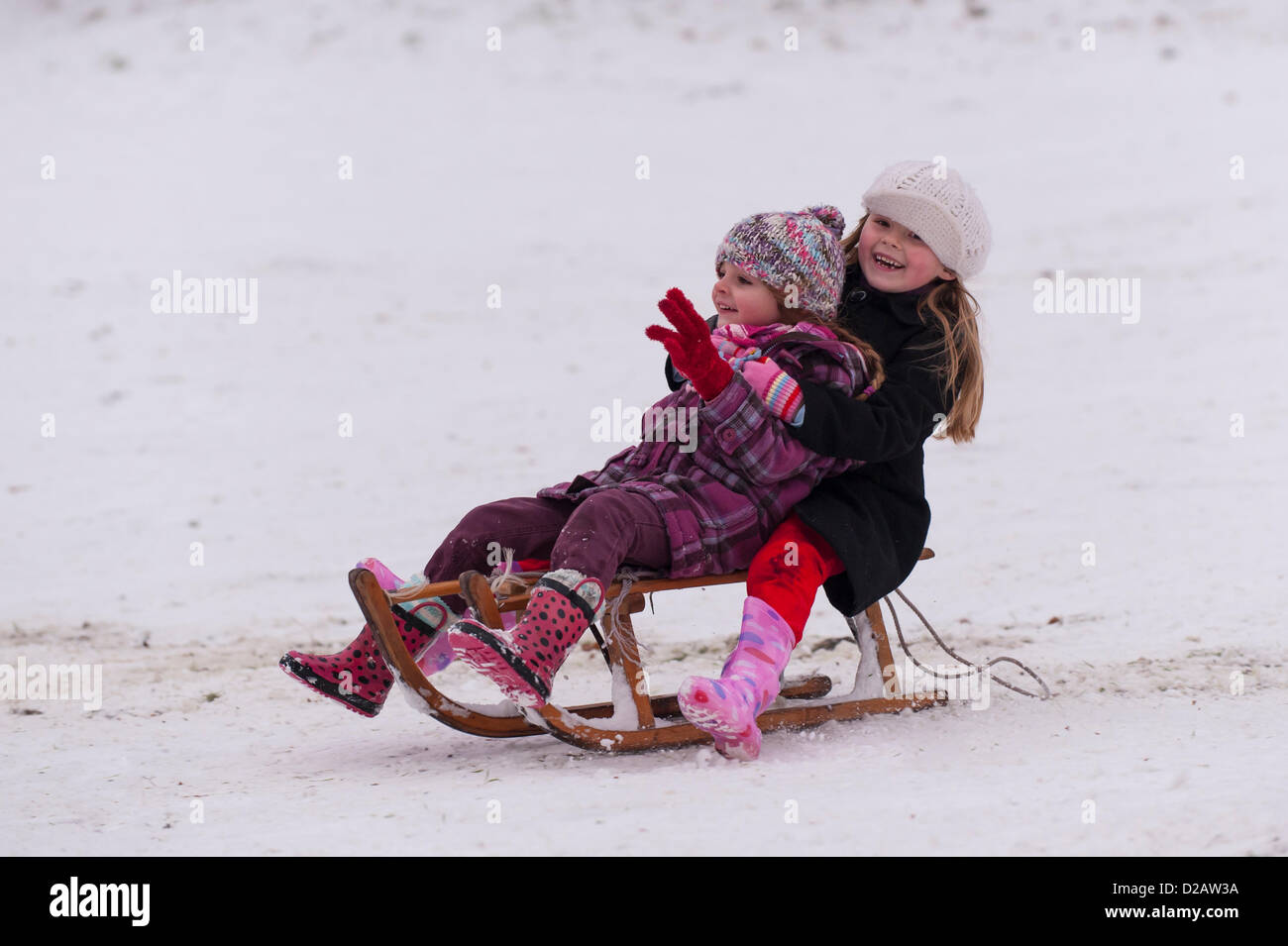 Girl on a sledge hi-res stock photography and images - Alamy