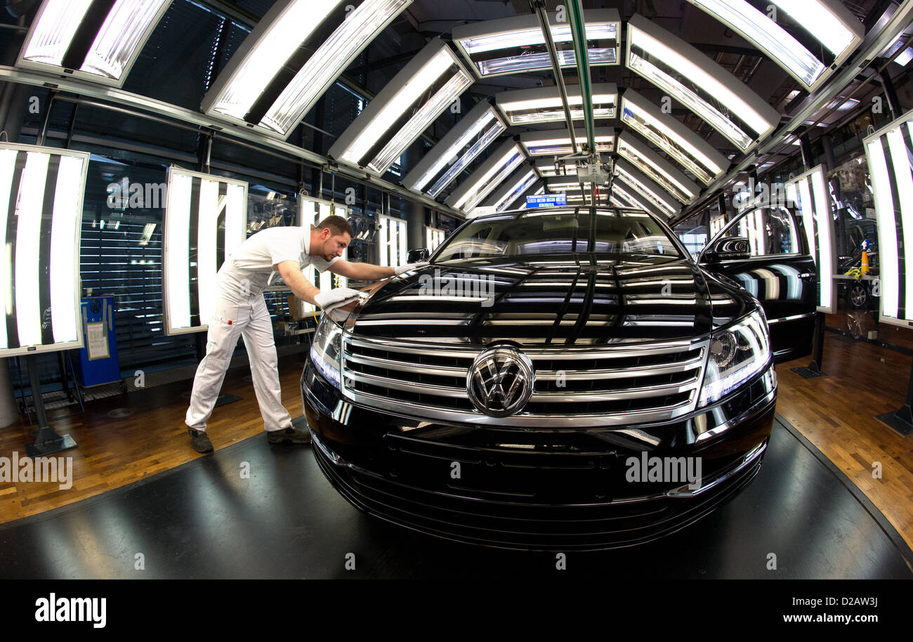An employee of car manufacturer Volkswagen (VW) conducts the final ...