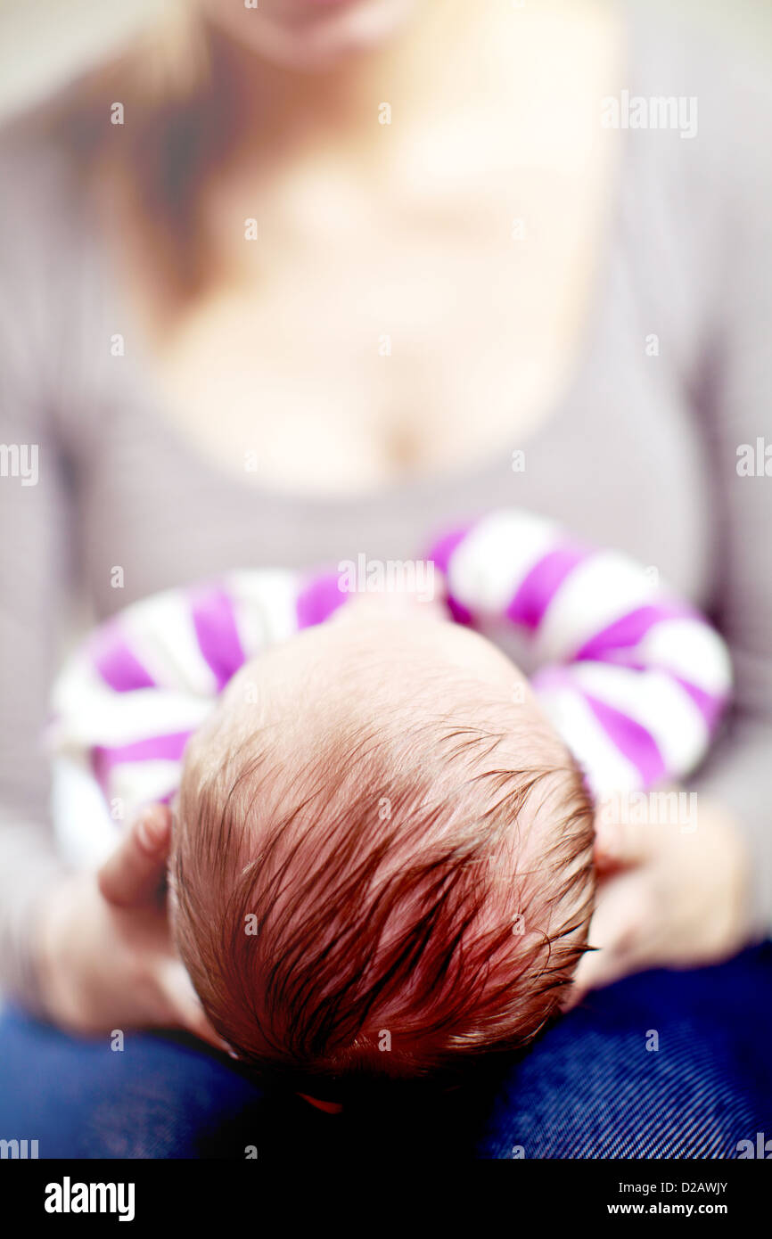 Newborn baby mother cradling hi-res stock photography and images - Alamy