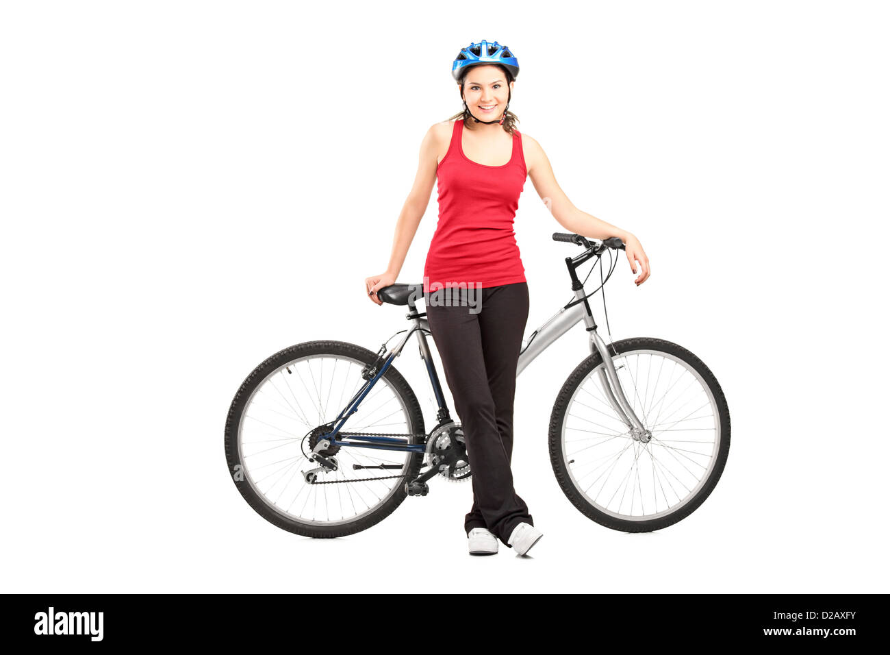 Full length portrait of a female biker with helmet posing next to a ...
