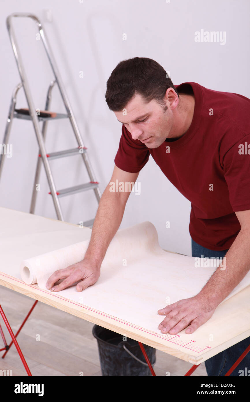 Man measuring paper Stock Photo - Alamy