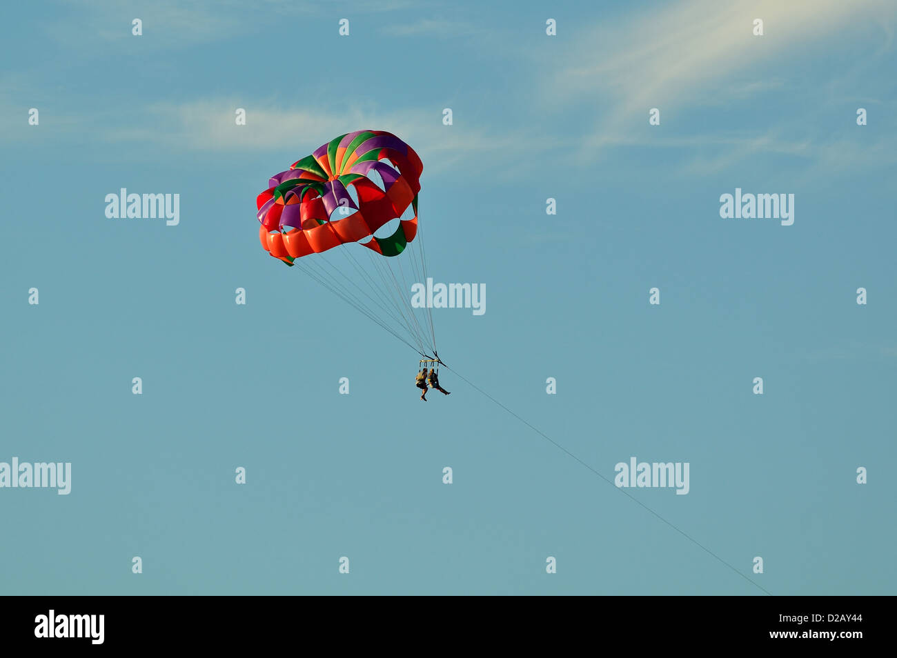 A couple para-gliding under colorful parachute. Key Largo Florida, USA ...