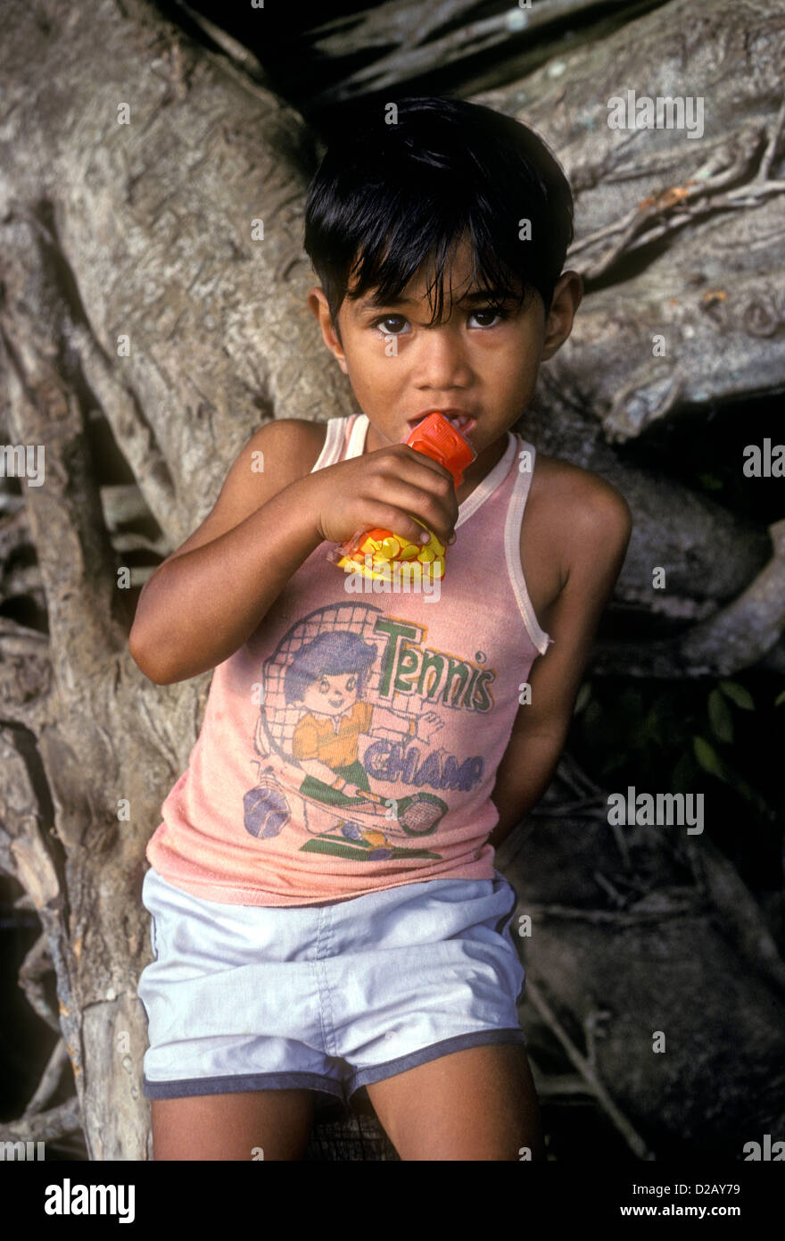 Fijian boy, eating snack, Taveuni, Taveuni Island, Fiji Island Group ...