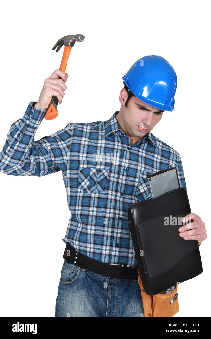 Man hammering a laptop computer Stock Photo - Alamy