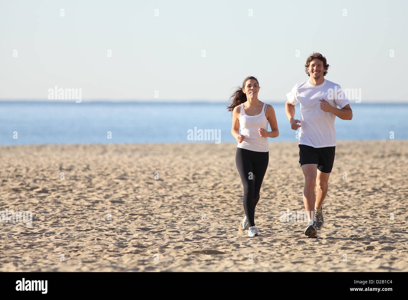 Running in the beach hi-res stock photography and images - Alamy