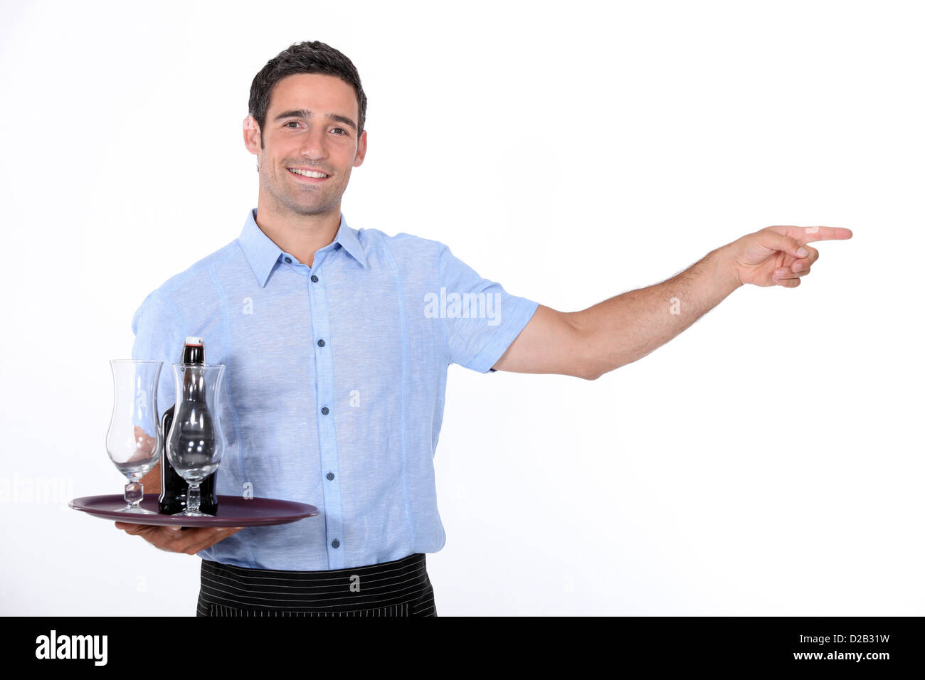 Waiter holding tray with beef bottle on it Stock Photo - Alamy