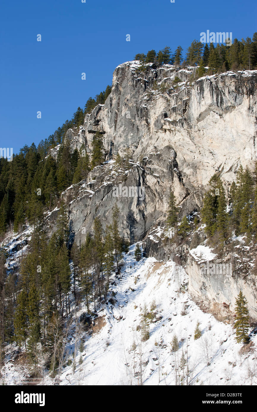 Snow near granite cliff Stock Photo - Alamy