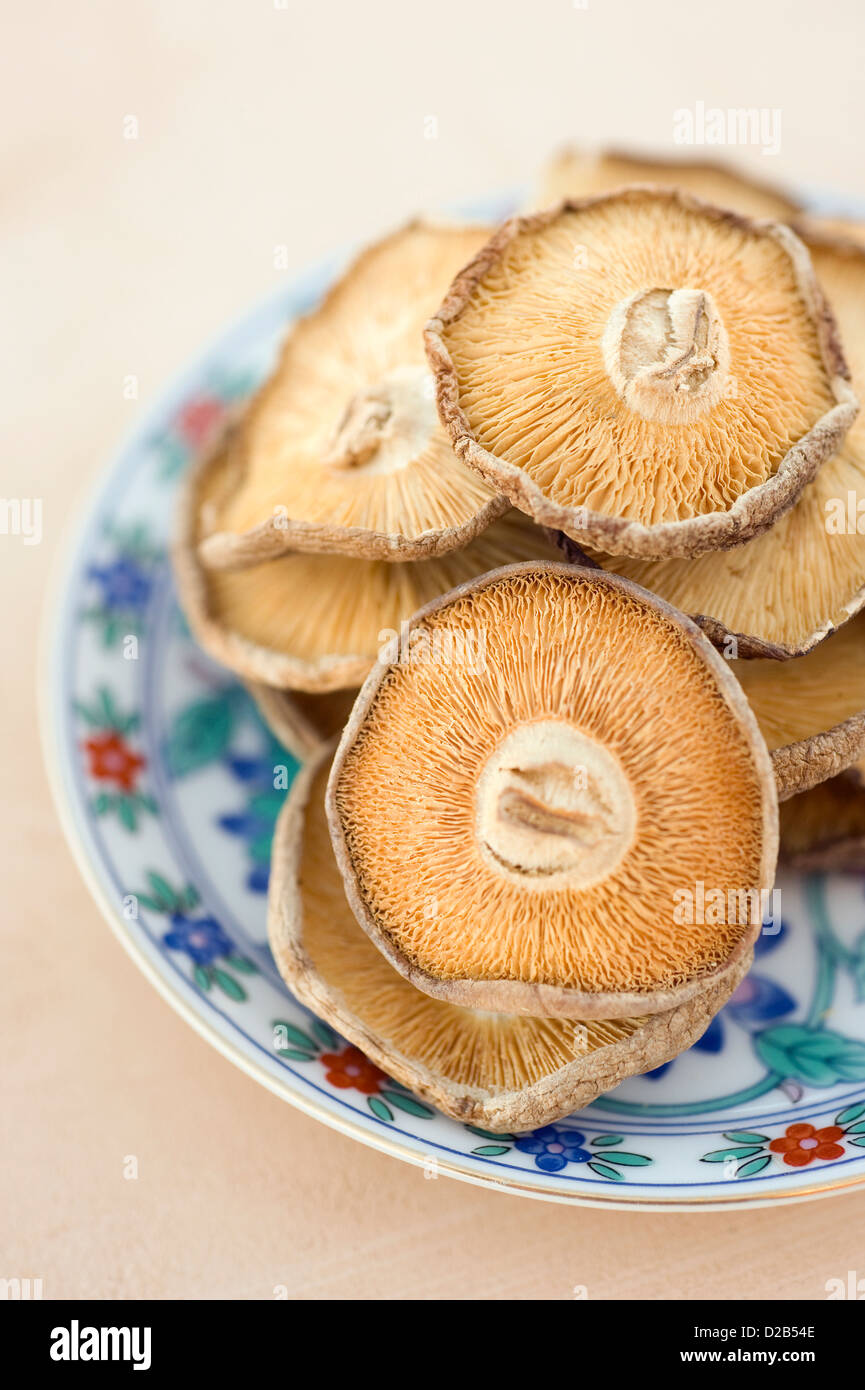 Dried Shitake mushrooms on a small asian plate Stock Photo - Alamy