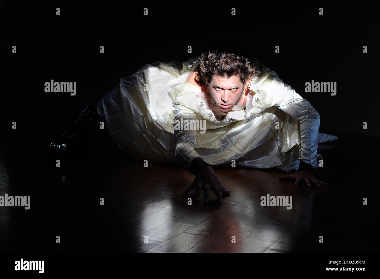 Man is white dress stalking Stock Photo - Alamy