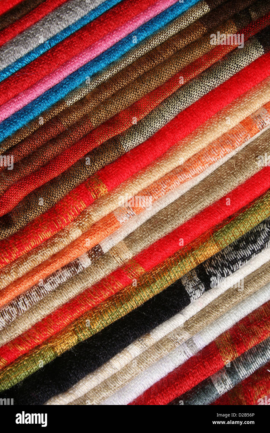 Colorful table cloths form an abstract assortment of colors and ...