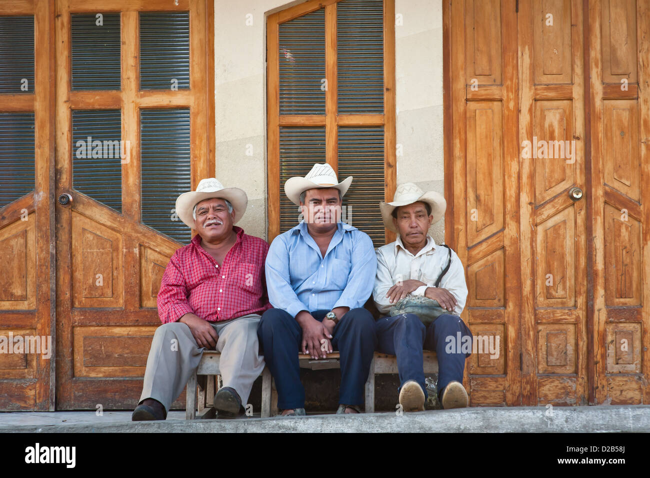 This is an image of 3 Guatemalan men sitting on the street in San Pedro ...