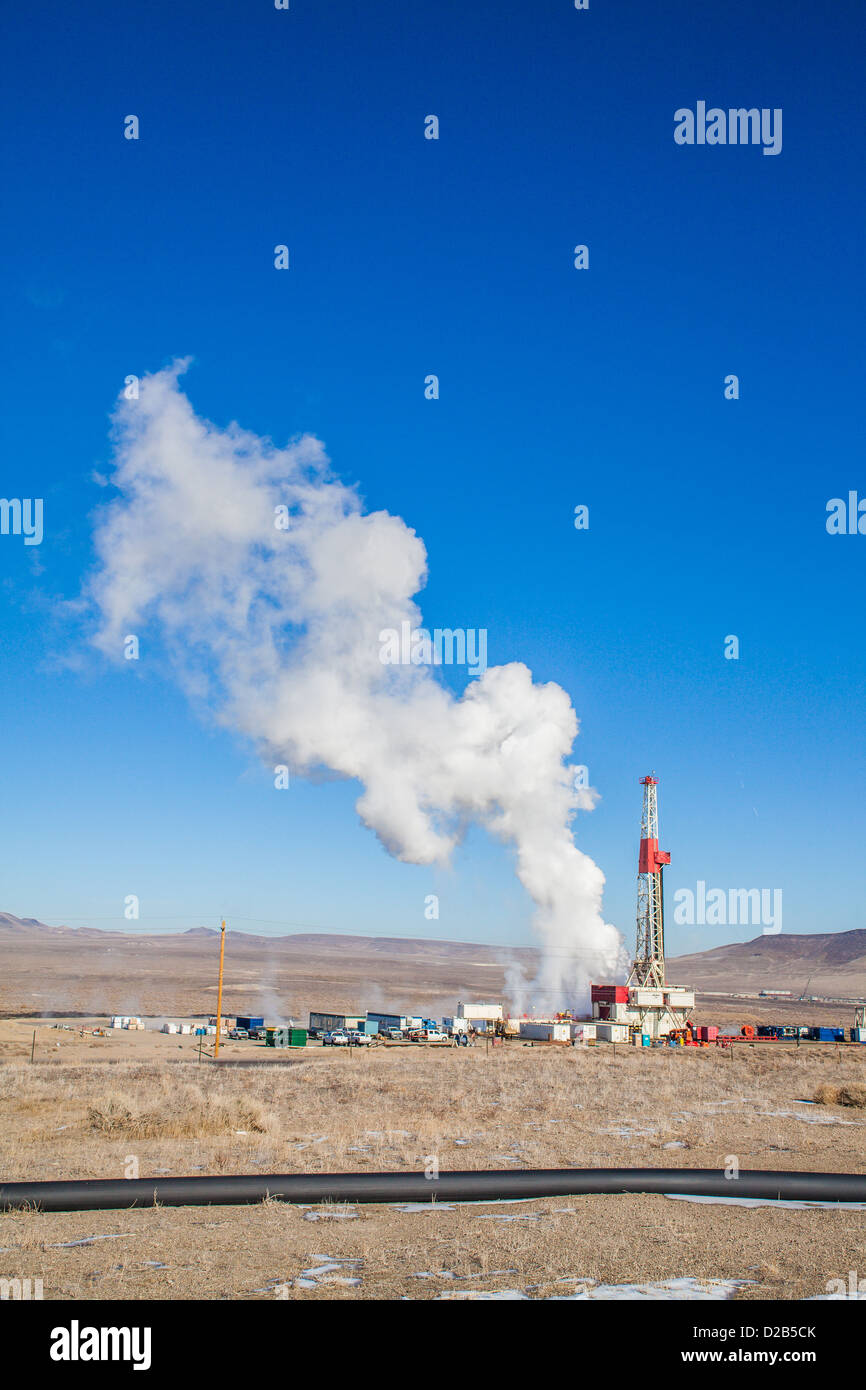 A drilling rig with a steam plume in the High Desert town of Fernley ...