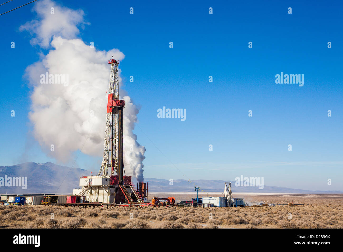 A drilling rig with a steam plume in the High Desert town of Fernley ...