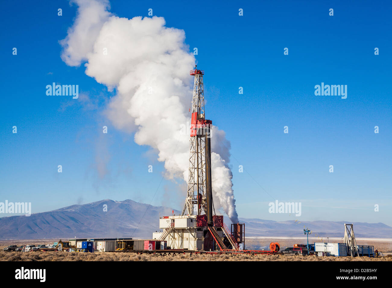 A drilling rig with a steam plume in the High Desert town of Fernley ...