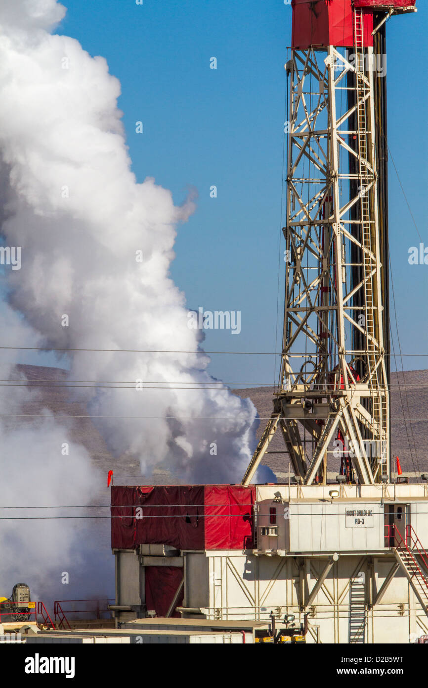 A drilling rig with a steam plume in the High Desert town of Fernley ...