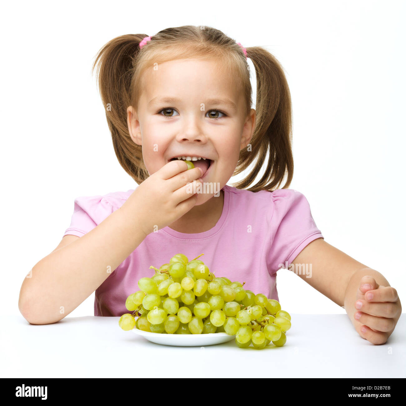 Girl eating grapes hi-res stock photography and images - Alamy