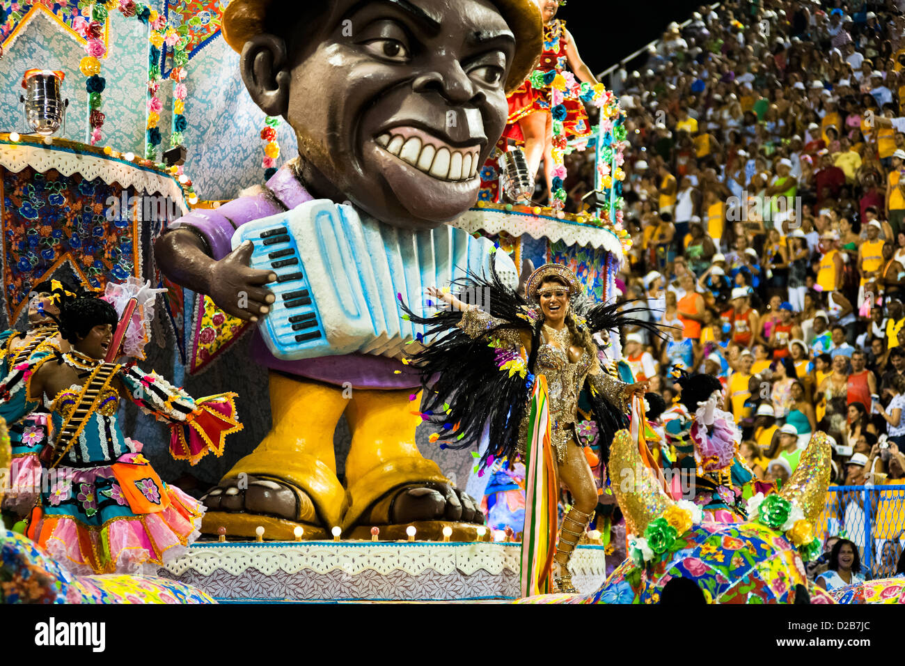 Dancers of Portela samba school perform on a float during the Carnival ...