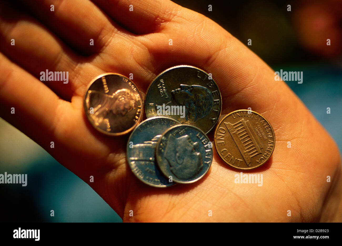 Close up hand holding money coins quarter dime hi-res stock photography ...
