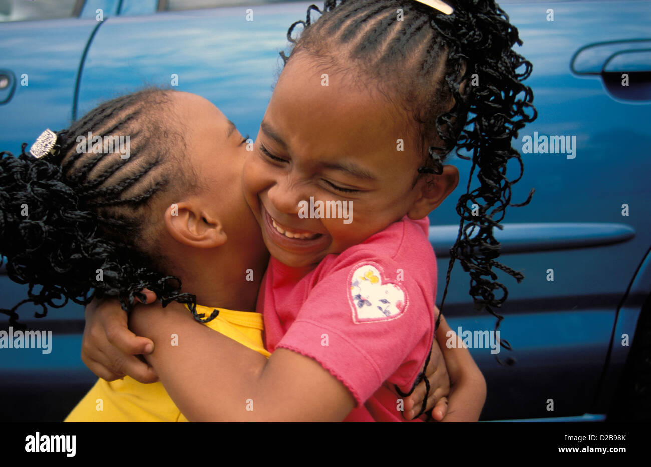 Twin sisters hugging each other hi-res stock photography and images - Alamy