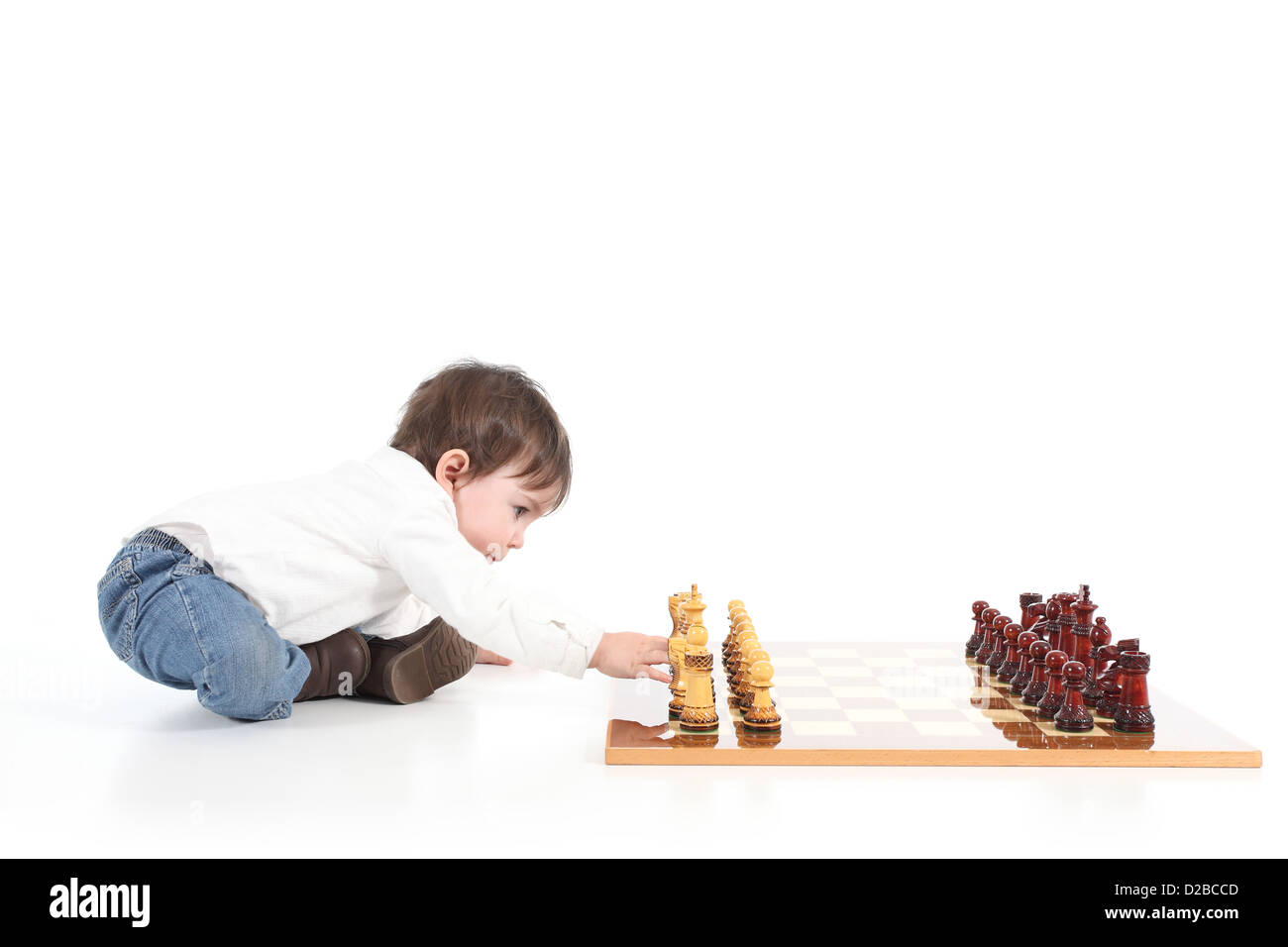 Baby playing chess on a white isolated background Stock Photo - Alamy