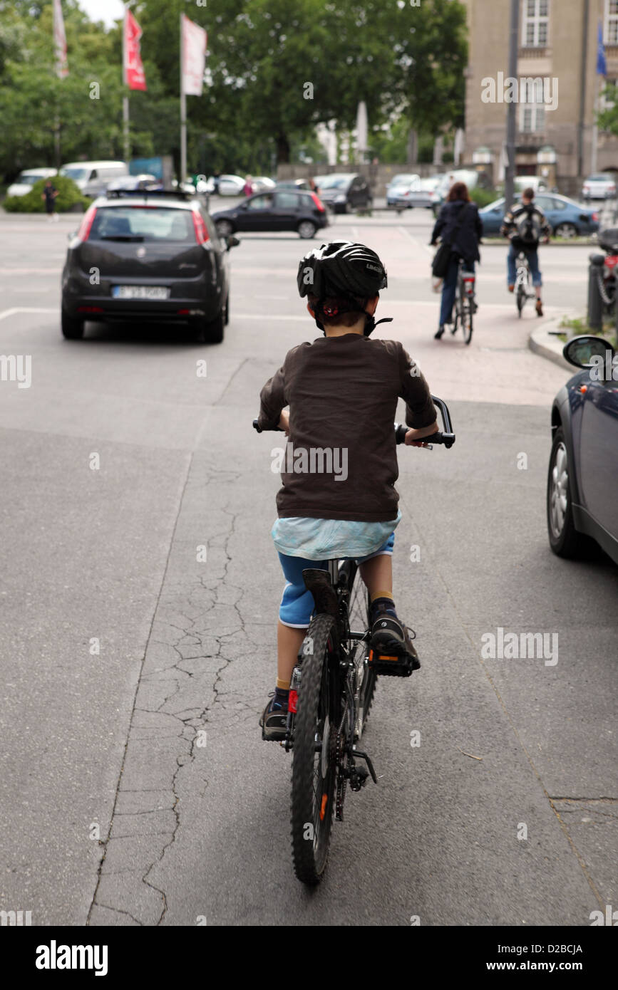 Berlin, Germany, kid rides his bike in the street Stock Photo - Alamy