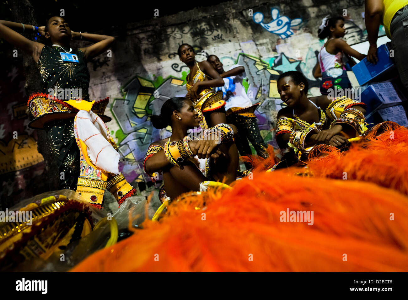 Samba school dancers prepare their costumes before entering the ...