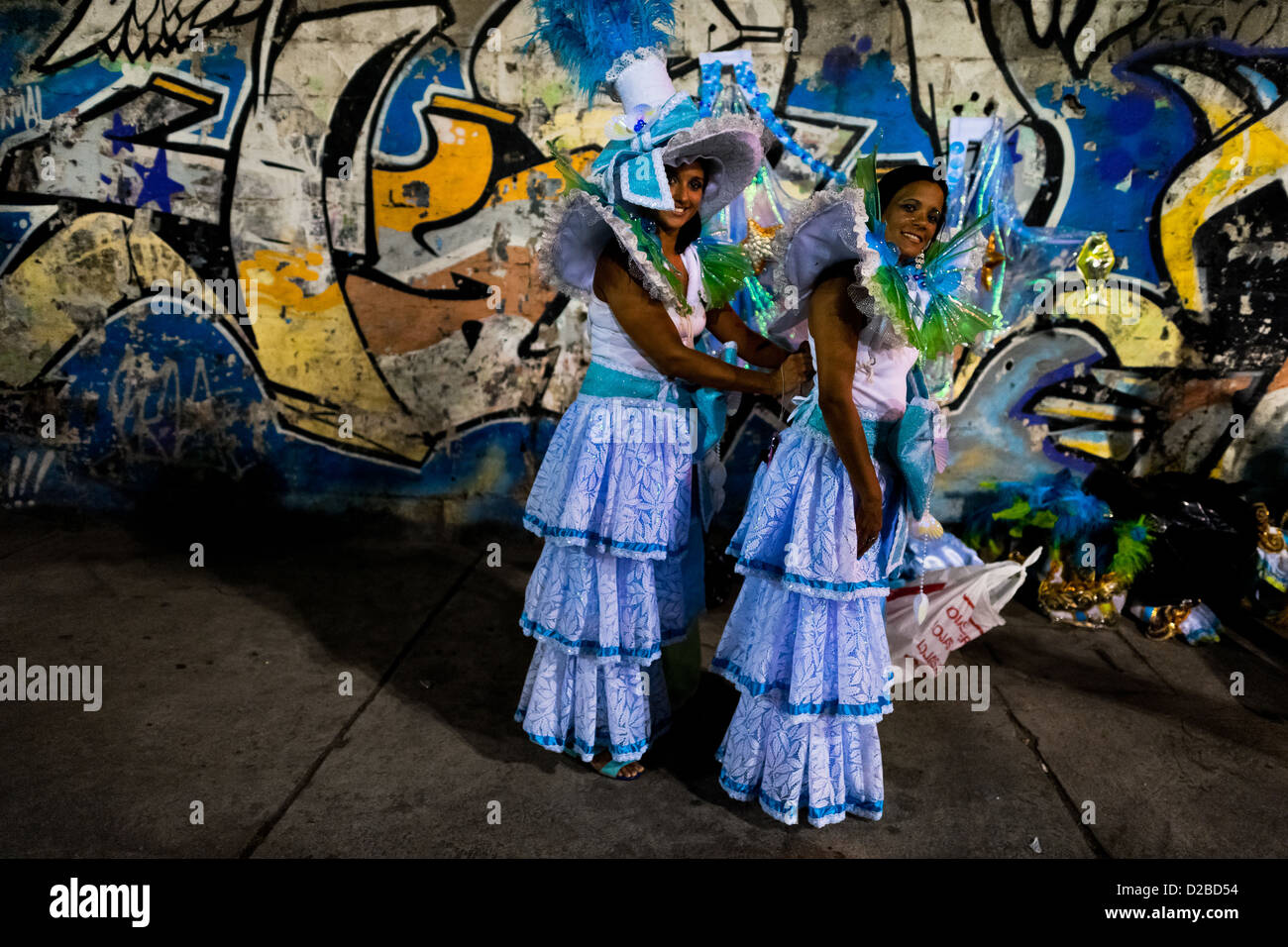Samba school dancers prepare their costumes before entering the ...