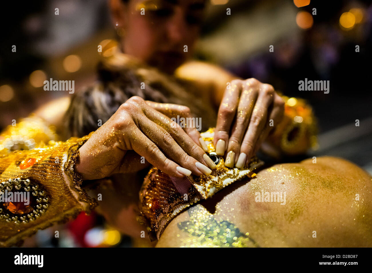 Samba school dancers prepare their costumes before entering the ...