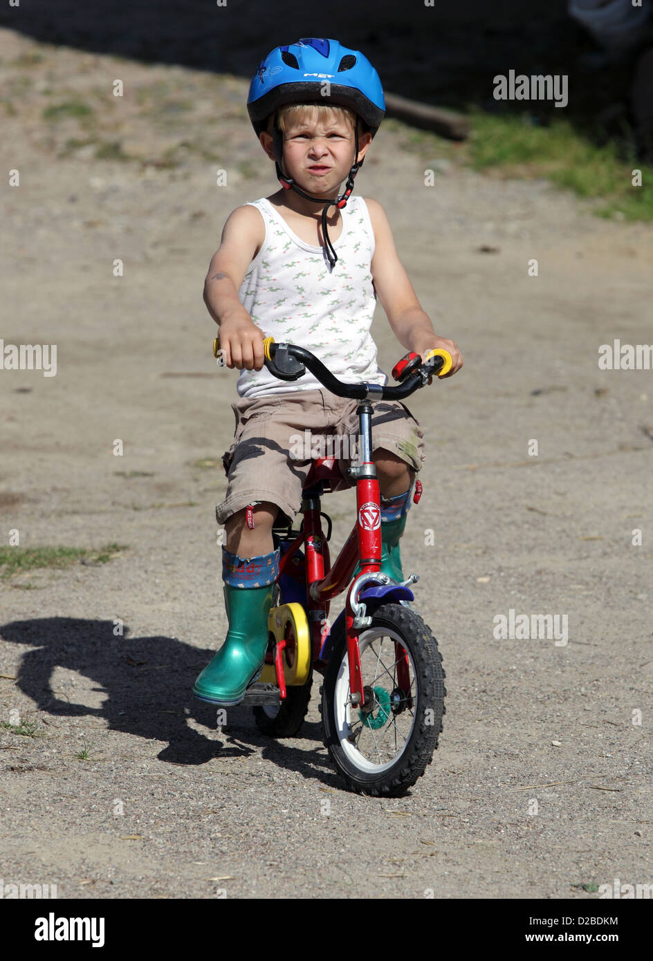 Boy Rides Bike High Resolution Stock Photography and Images - Alamy
