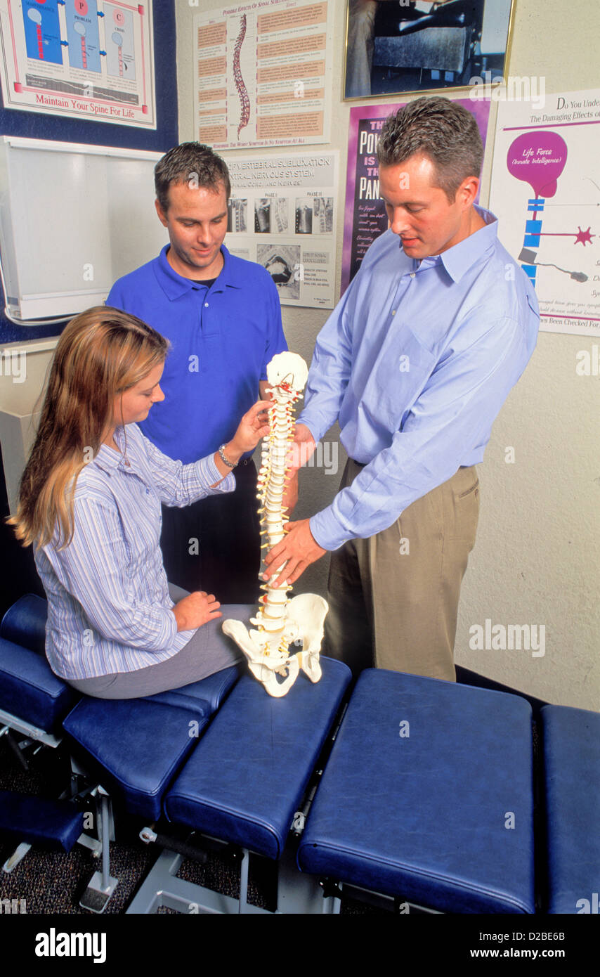 Chiropractor Demonstrating Spine To Patients Stock Photo - Alamy