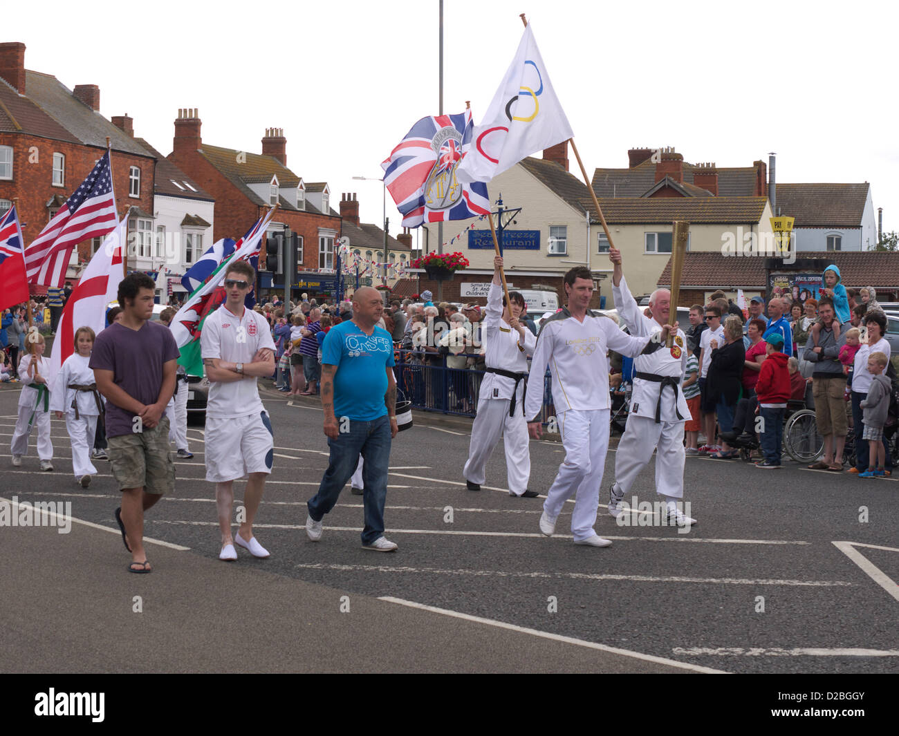 Olympic torchbearers taking part in the Sutton on sea carnival parade ...