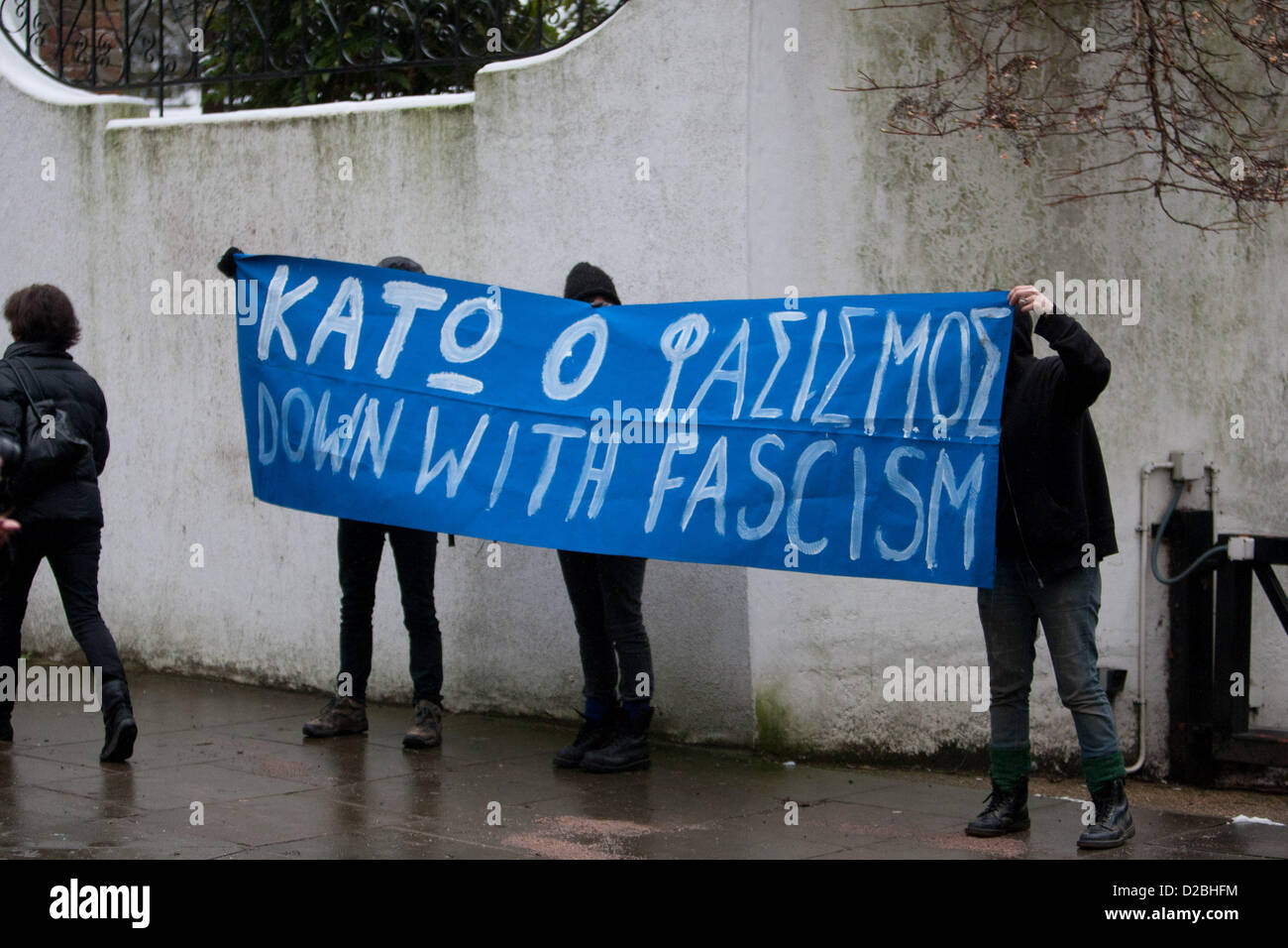London, UK, 19 January 2013 Anti fascists hold up a banner reading ...