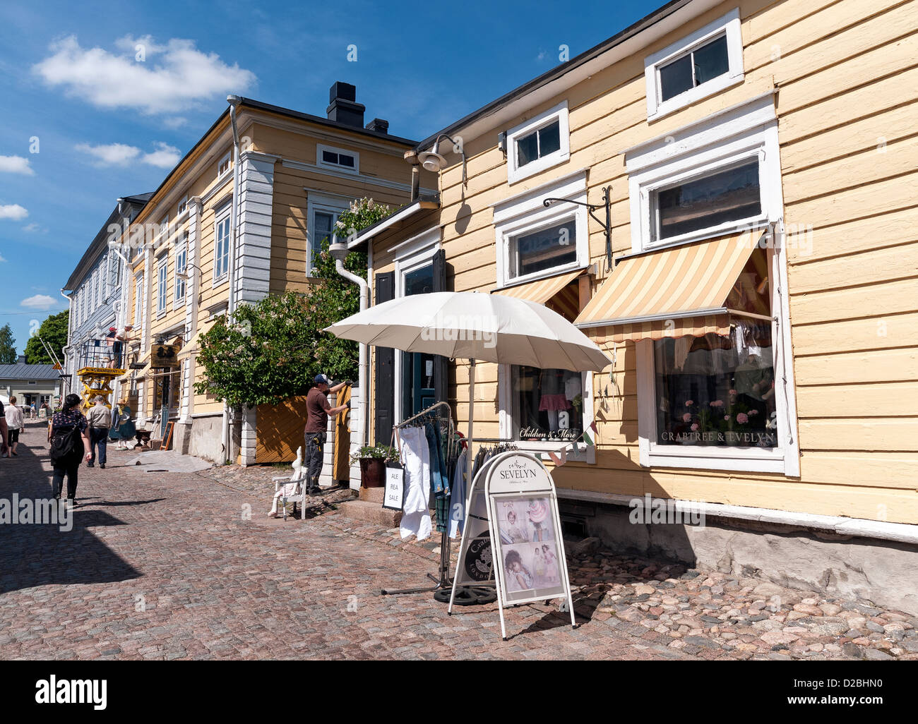 Shops and cafes in the traditional wooden style buildings in Old Porvoo ...
