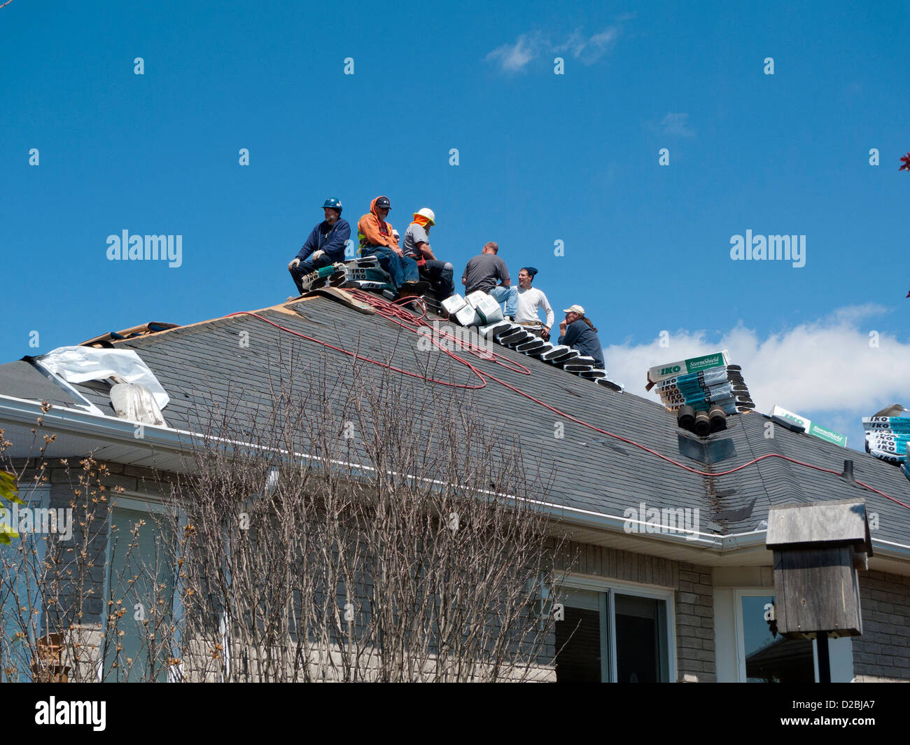 Roofing crew having a lunch break whilst putting on new roof Ontario ...