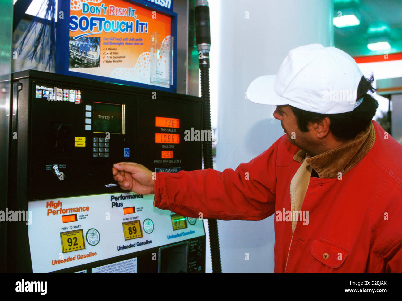 Man Using Automated Pump At Gas Station. Accepts Credit /Debit Cards ...