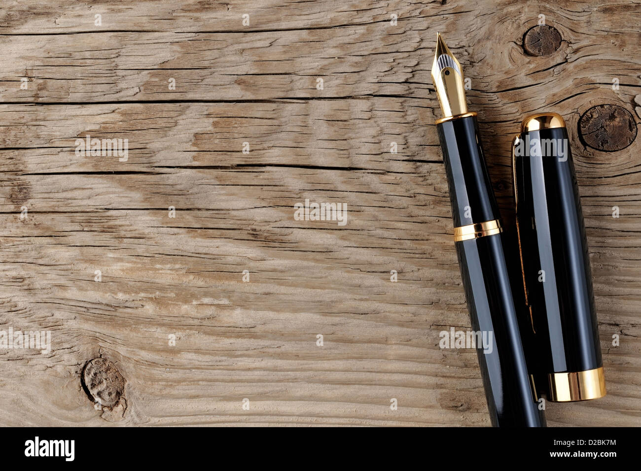 Fountain pen on old wooden background Stock Photo - Alamy