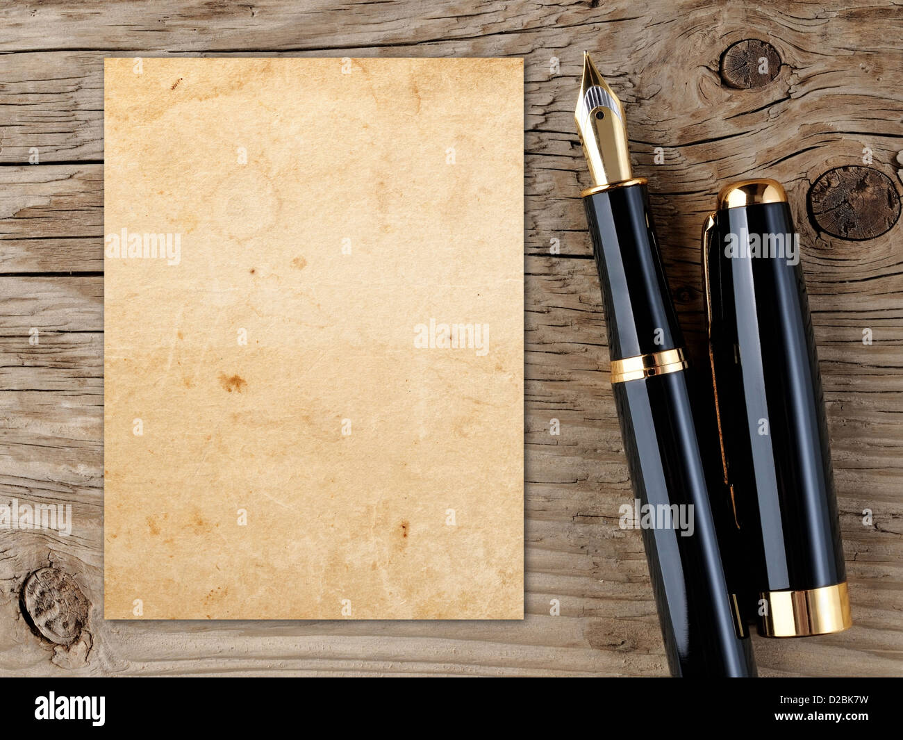 Fountain pen and vintage paper on old wooden background Stock Photo - Alamy