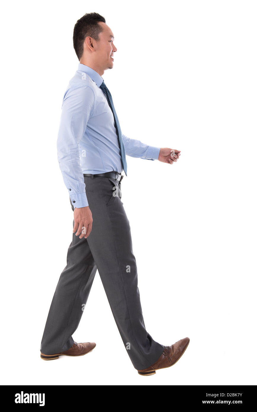 Side view full body Chinese Asian male walking looking forward isolated ...