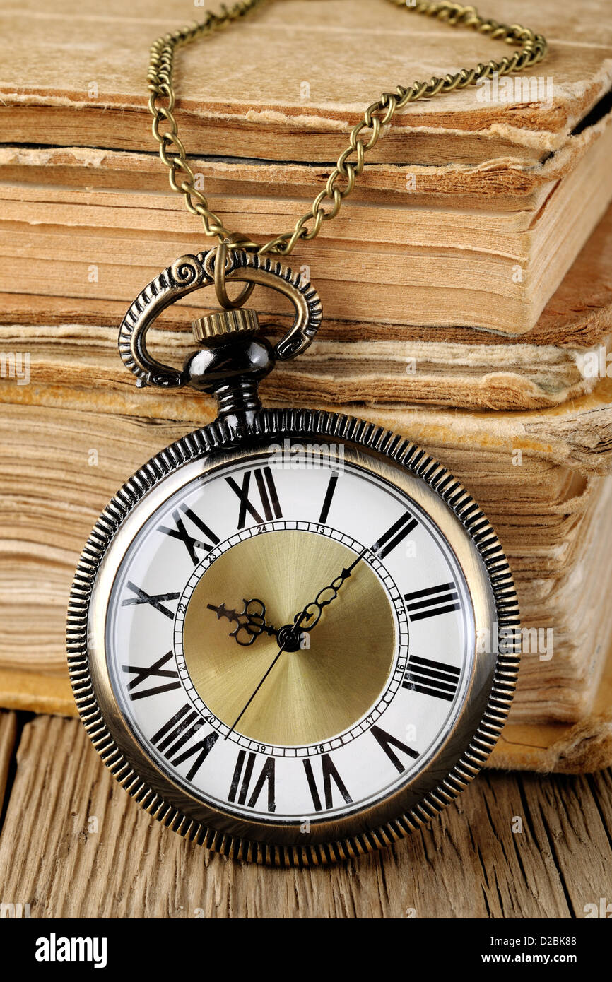 Antique watch and books Stock Photo - Alamy