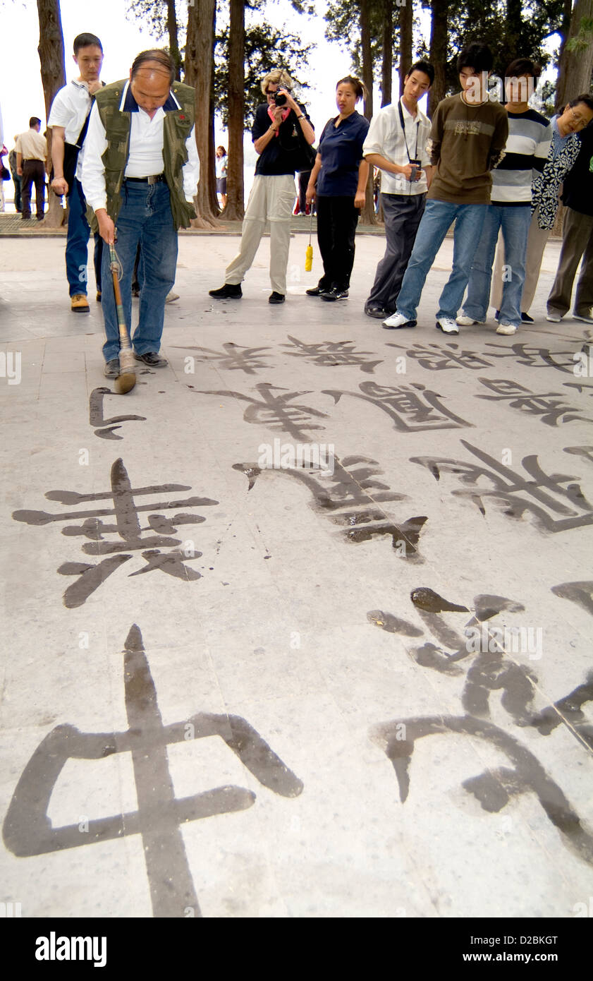 China, Beijing. Man Writing Chinese Calligraphy Outdoors Stock Photo ...