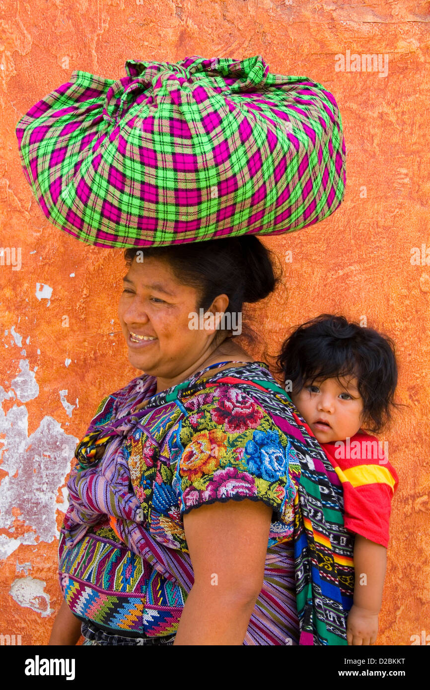 Guatemala, Antigua, Woman Carrying Baby On Back Stock Photo - Alamy