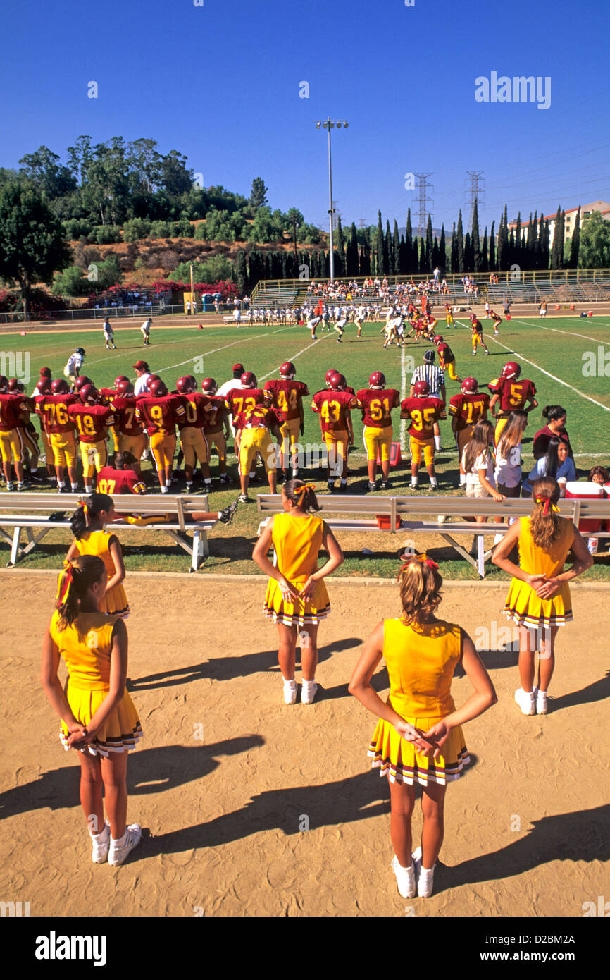 Cheerleaders And High School Football Team Stock Photo - Alamy